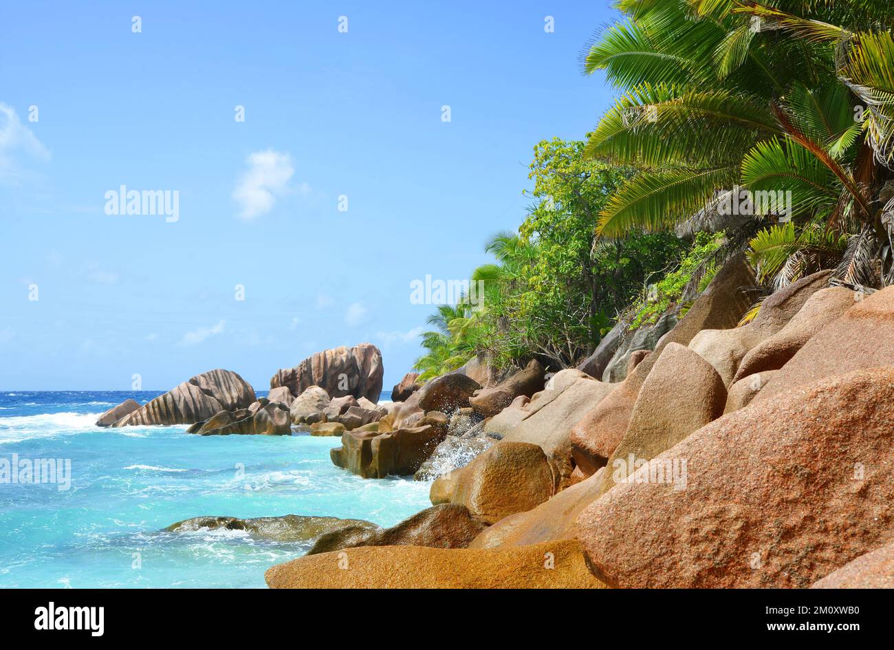 Anse Cocos beach with big granite stones in La Digue Island, Indian ...