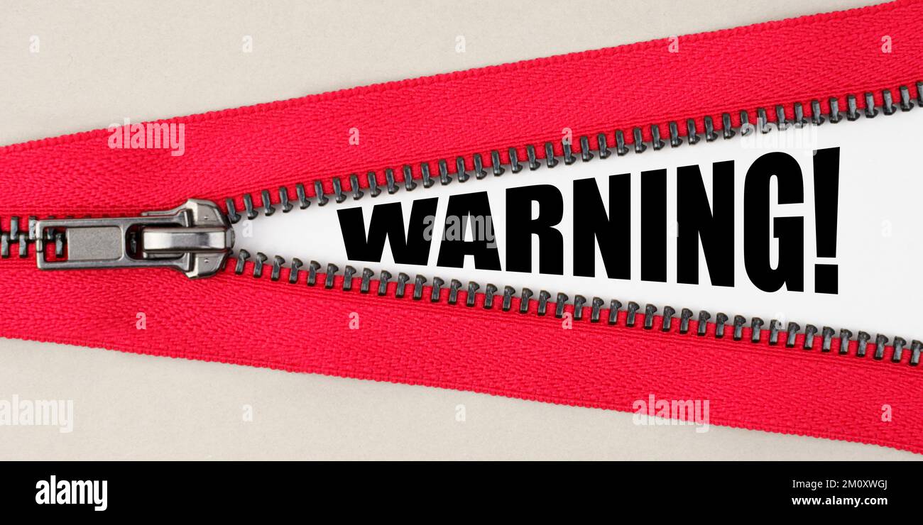Finance and business concept. On a gray background, a red zipper ...