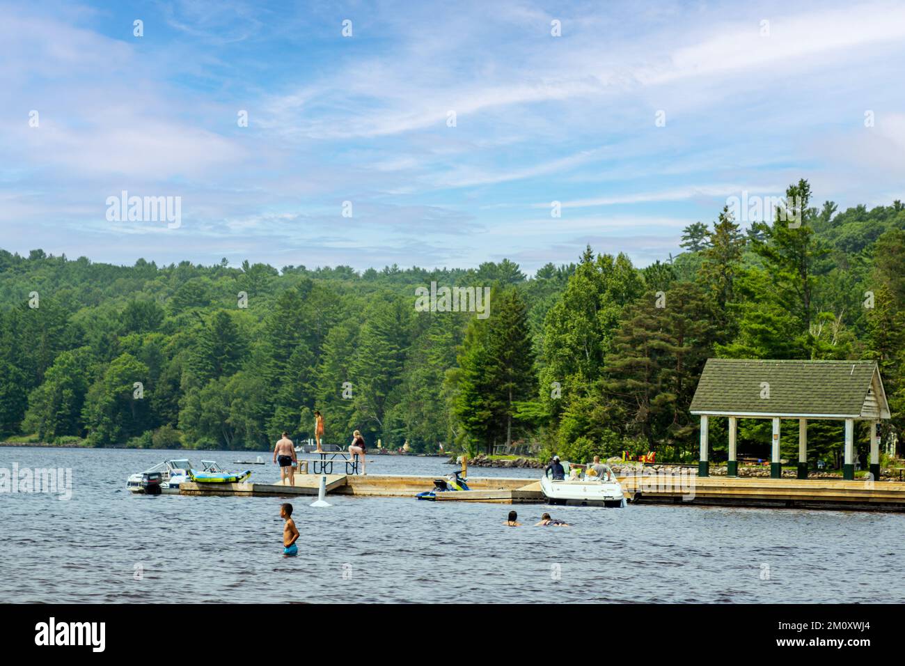 August 2021 - Visitors enjoying water activities near the pier on lake ...