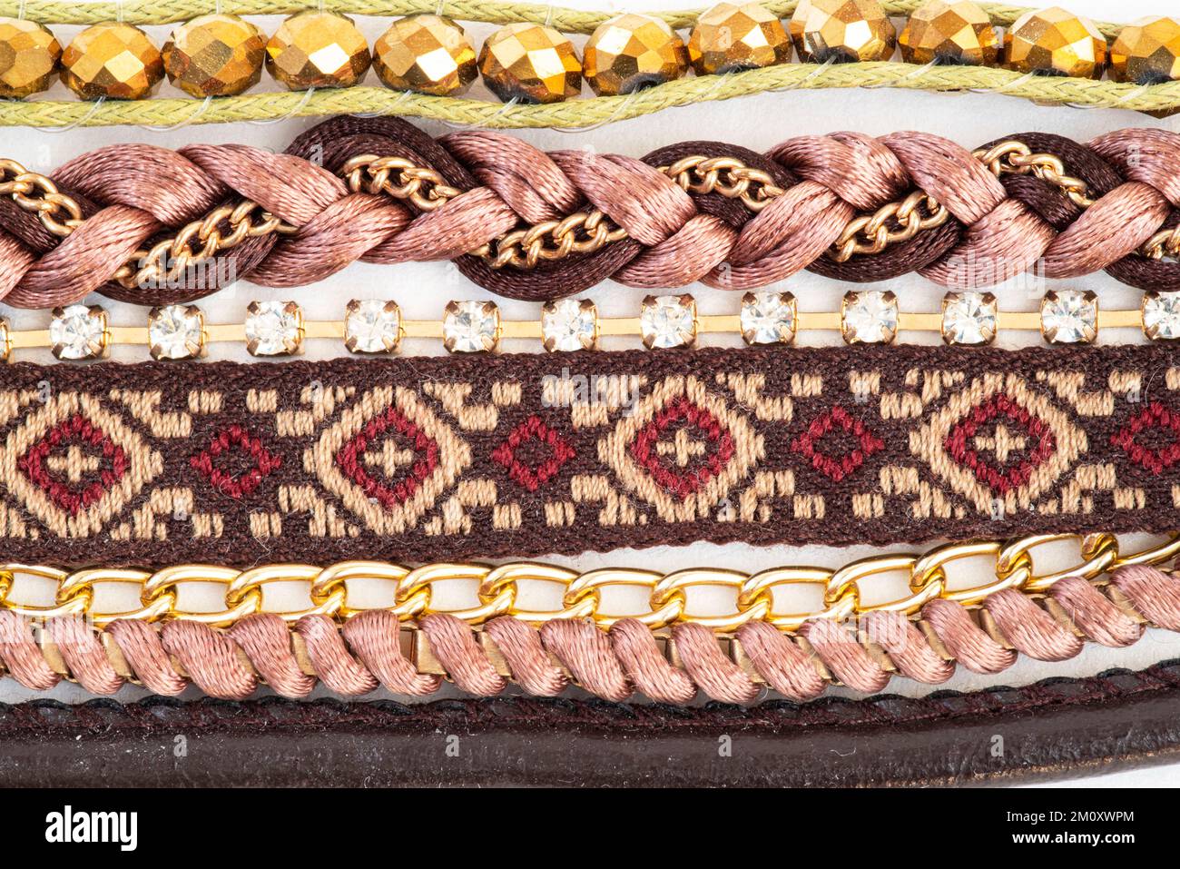 Close up on a metal jewel, wire and pearl. A bracelet or a necklace ...