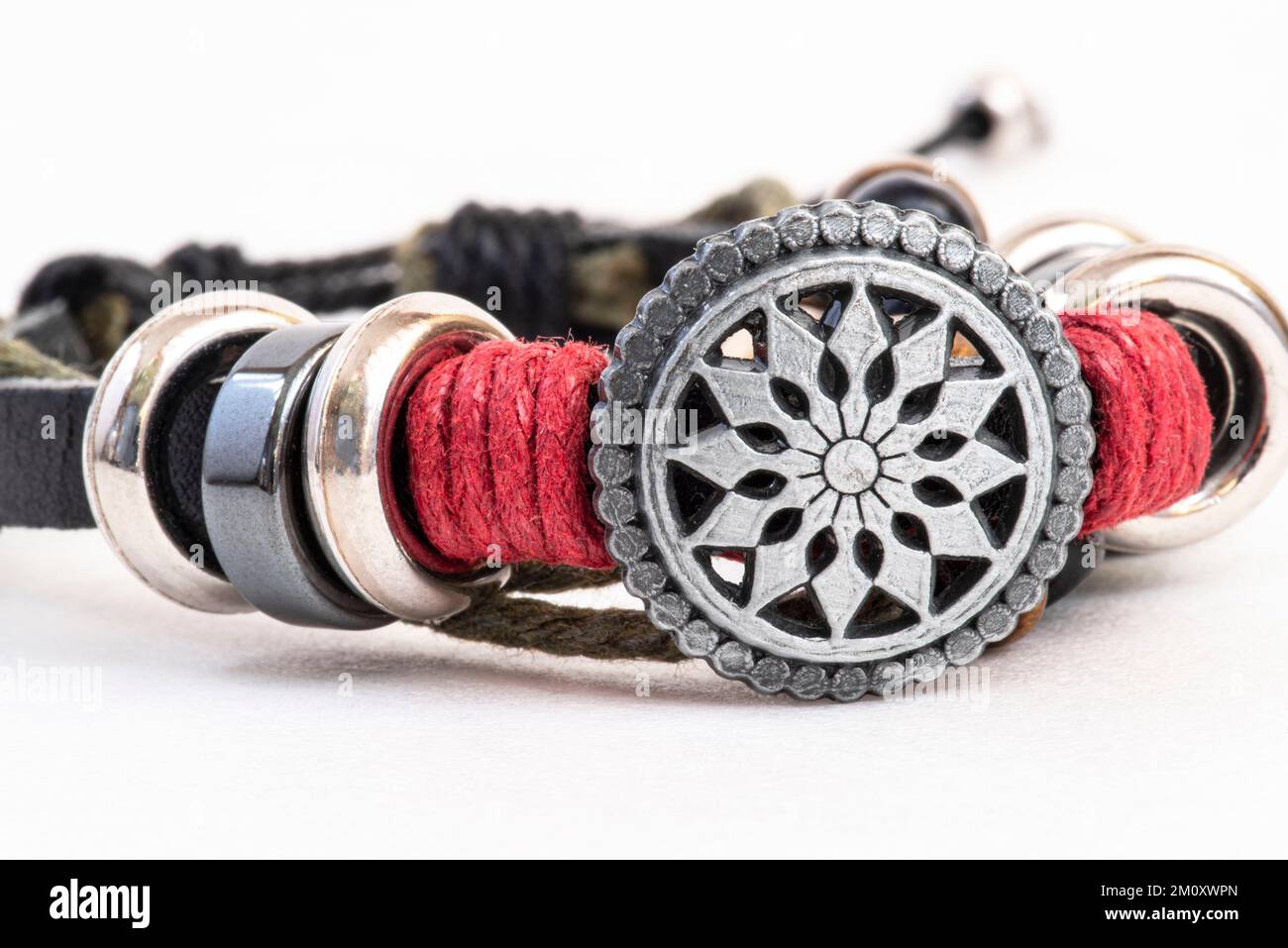 Close up on a metal jewel, wire and pearl. A bracelet or a necklace ...