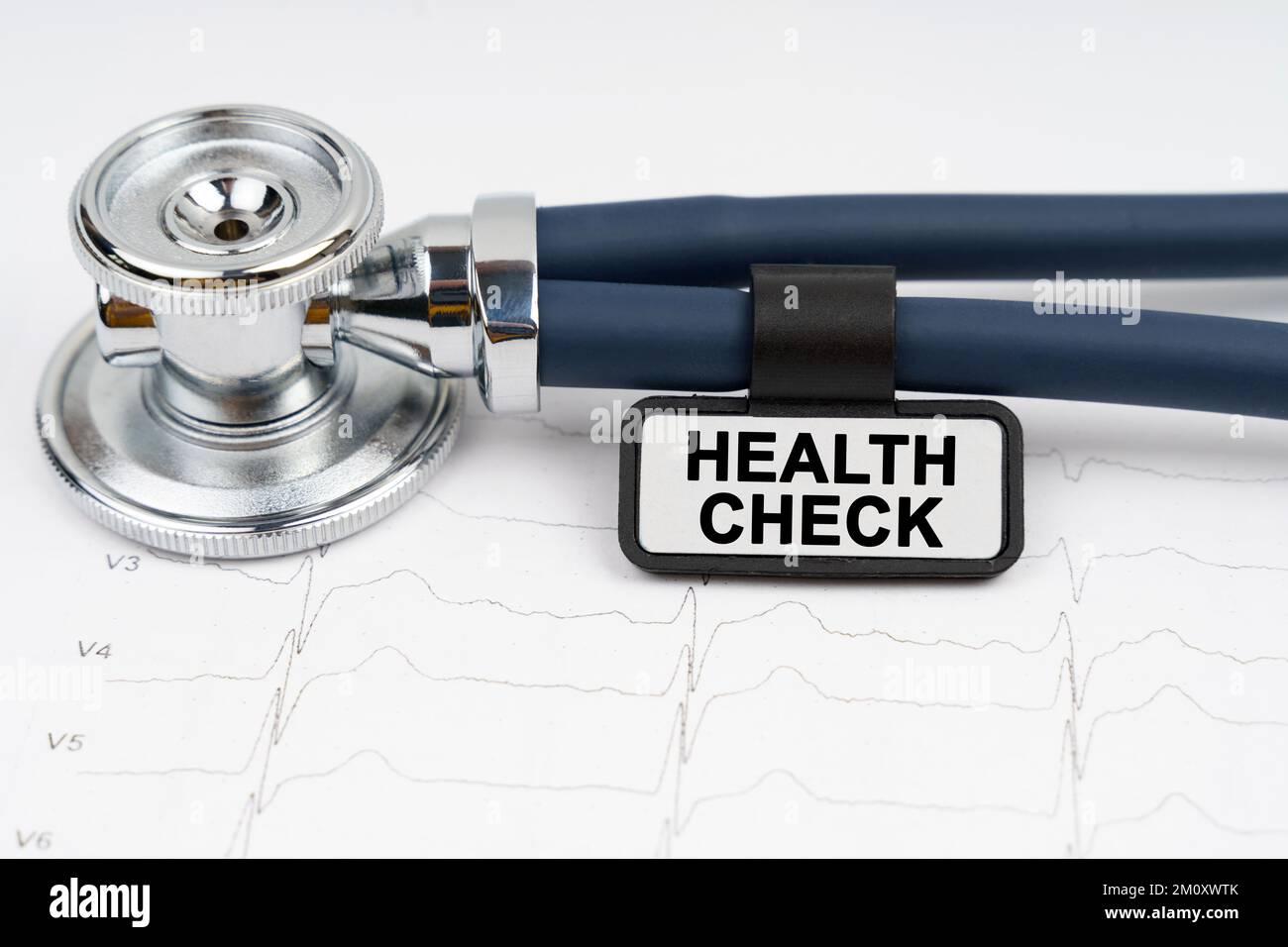 Medicine and health concept. On the cardiogram is a stethoscope and a ...