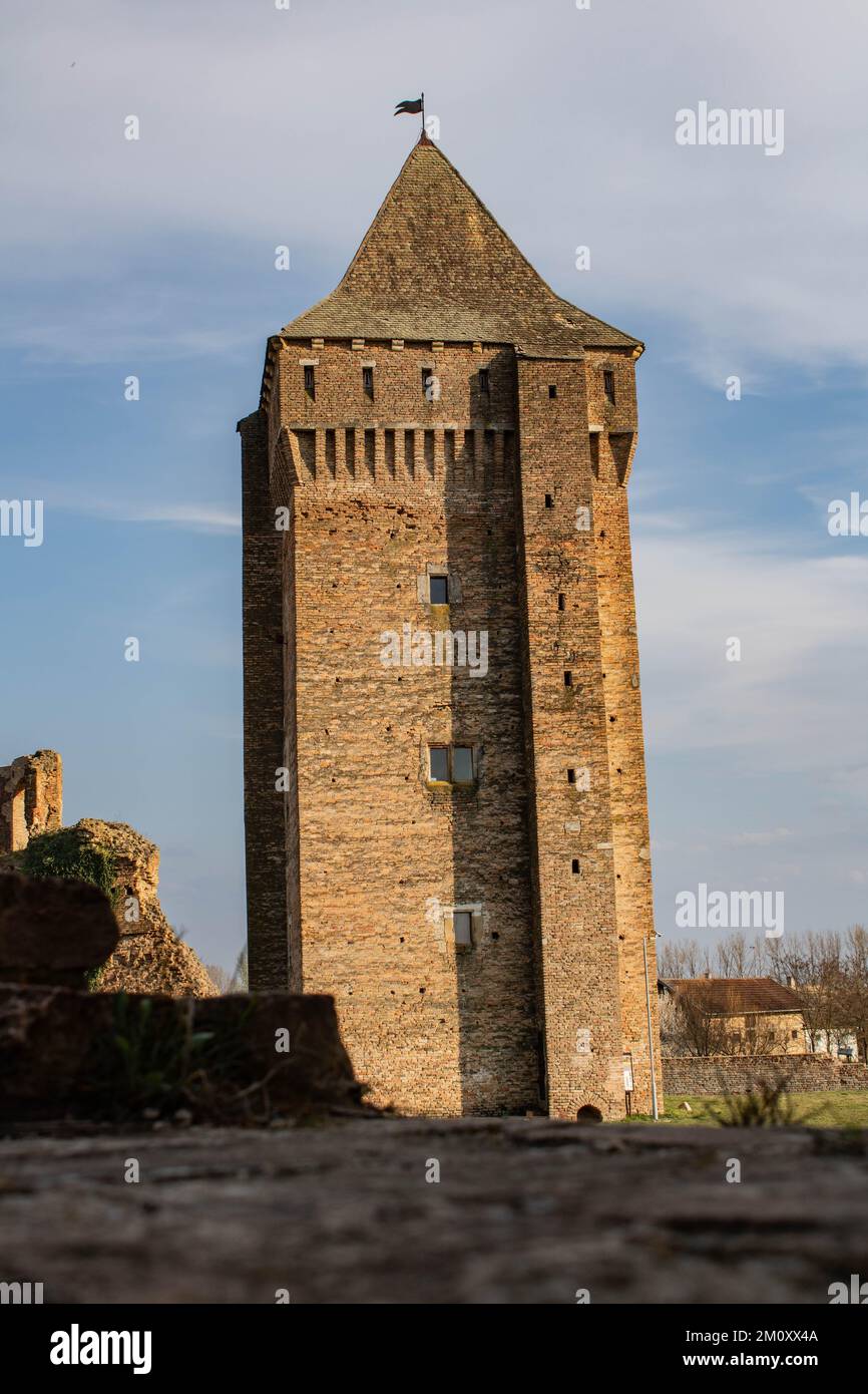 A vertical shot of a medieval Bac fortress illuminated by sun rays in ...
