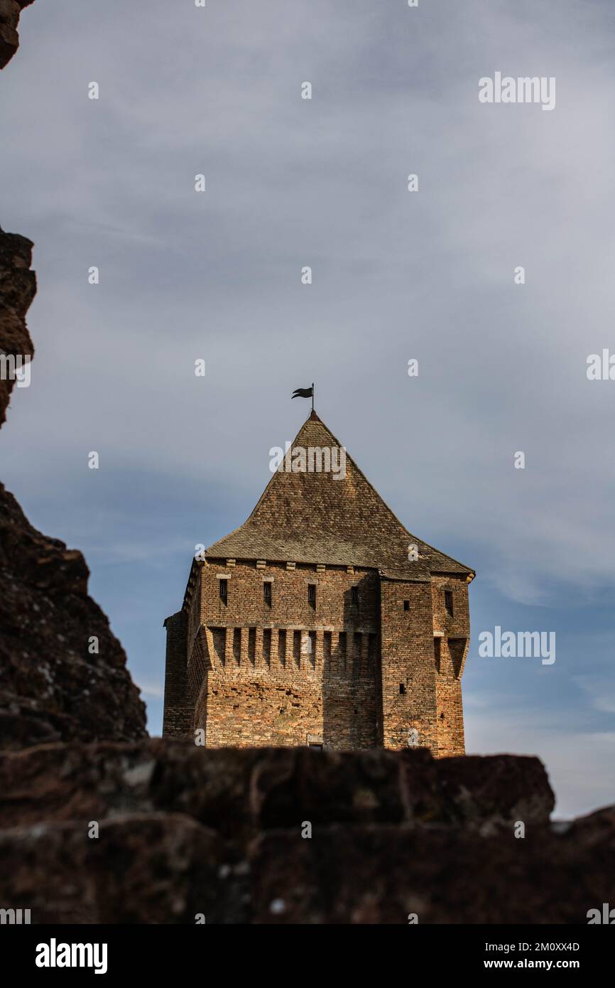 A vertical shot of a medieval Bac fortress under a cloudy sky in Bac ...