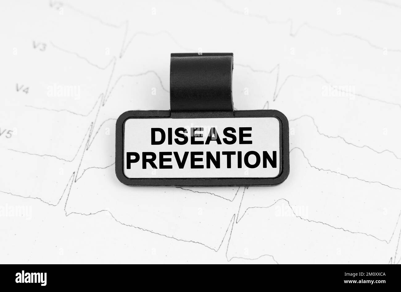 Medicine and health concept. There is a plate on the cardiogram with ...