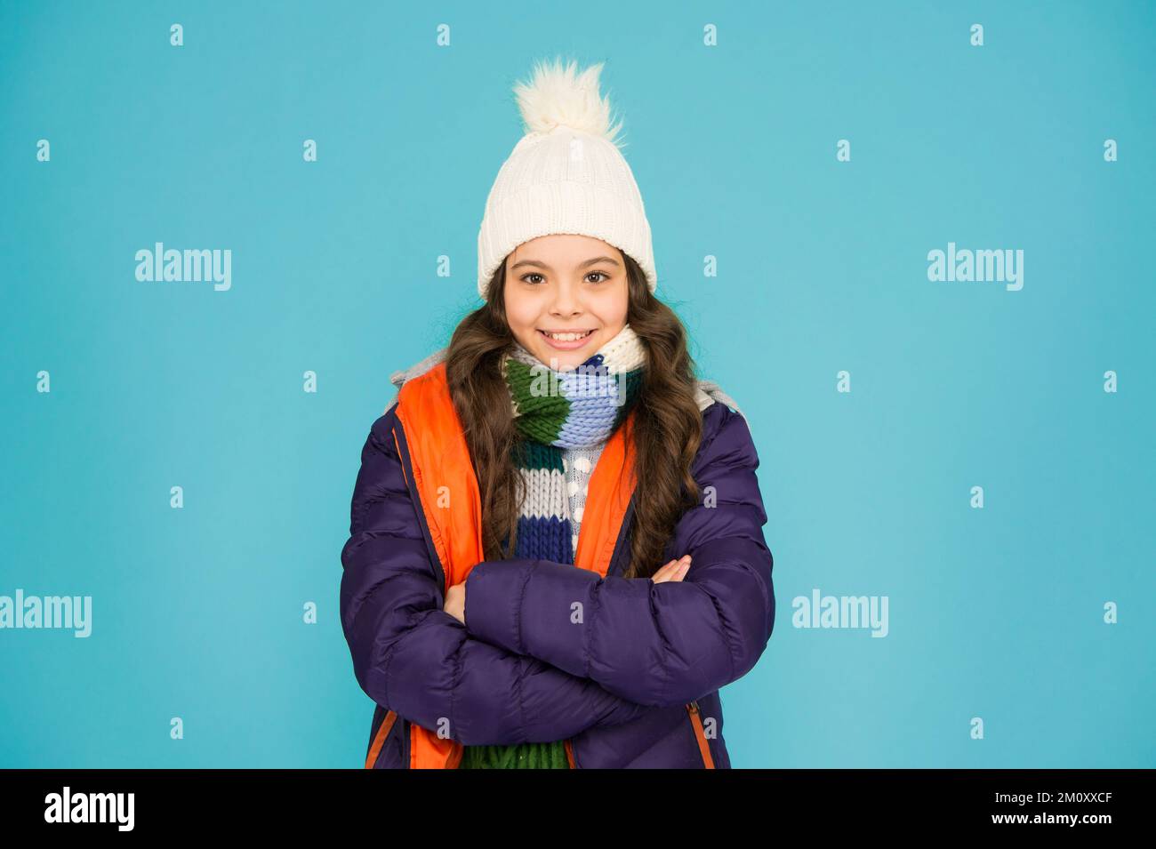 Fashion trend. Little kid wear hat and jacket blue background. Winter ...