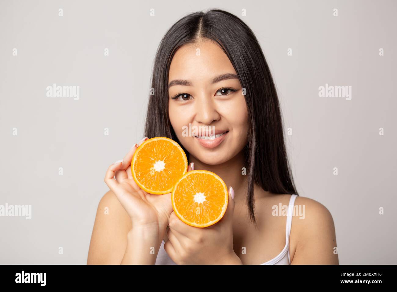 Vitamin C cosmetics woman with clean fresh skin. Facial treatment or ... Vitamin C cosmetics woman with clean fresh skin. Facial treatment or ...