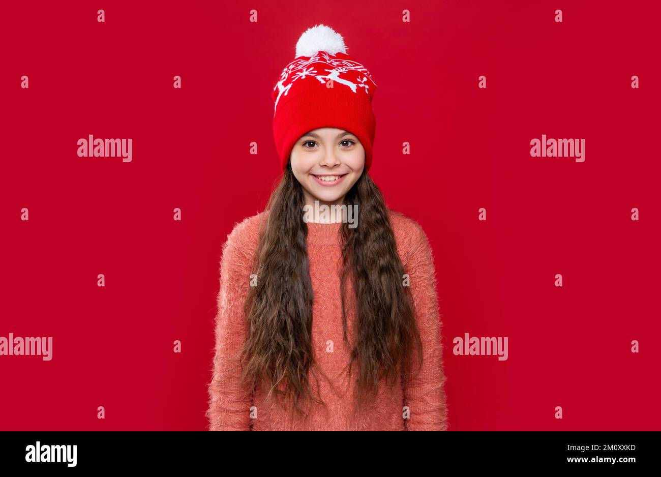 positive teen child in hat isolated on red background. teen child wear ...