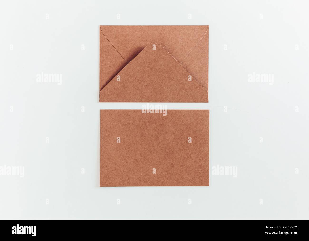 Brown recycle cardboard envelopes on the white background. Craft paper ...