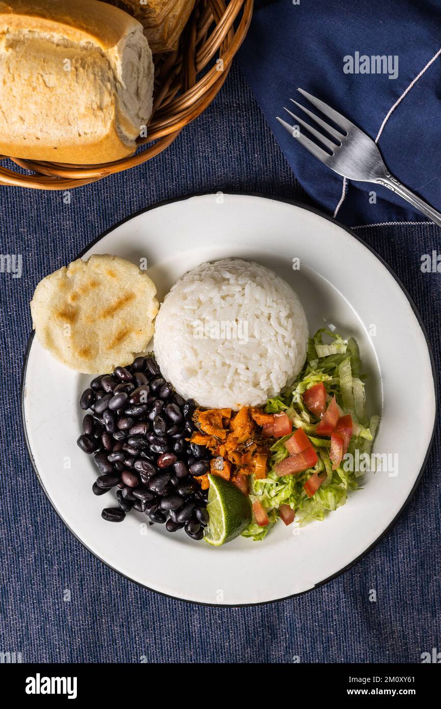 Top view of Casado, typical Costa Rican dish with rice, beans and ...