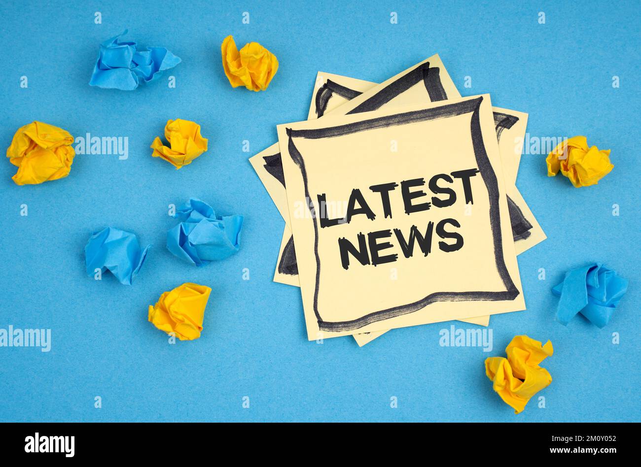 Business concept. On a blue background, there are pieces of paper and a ...