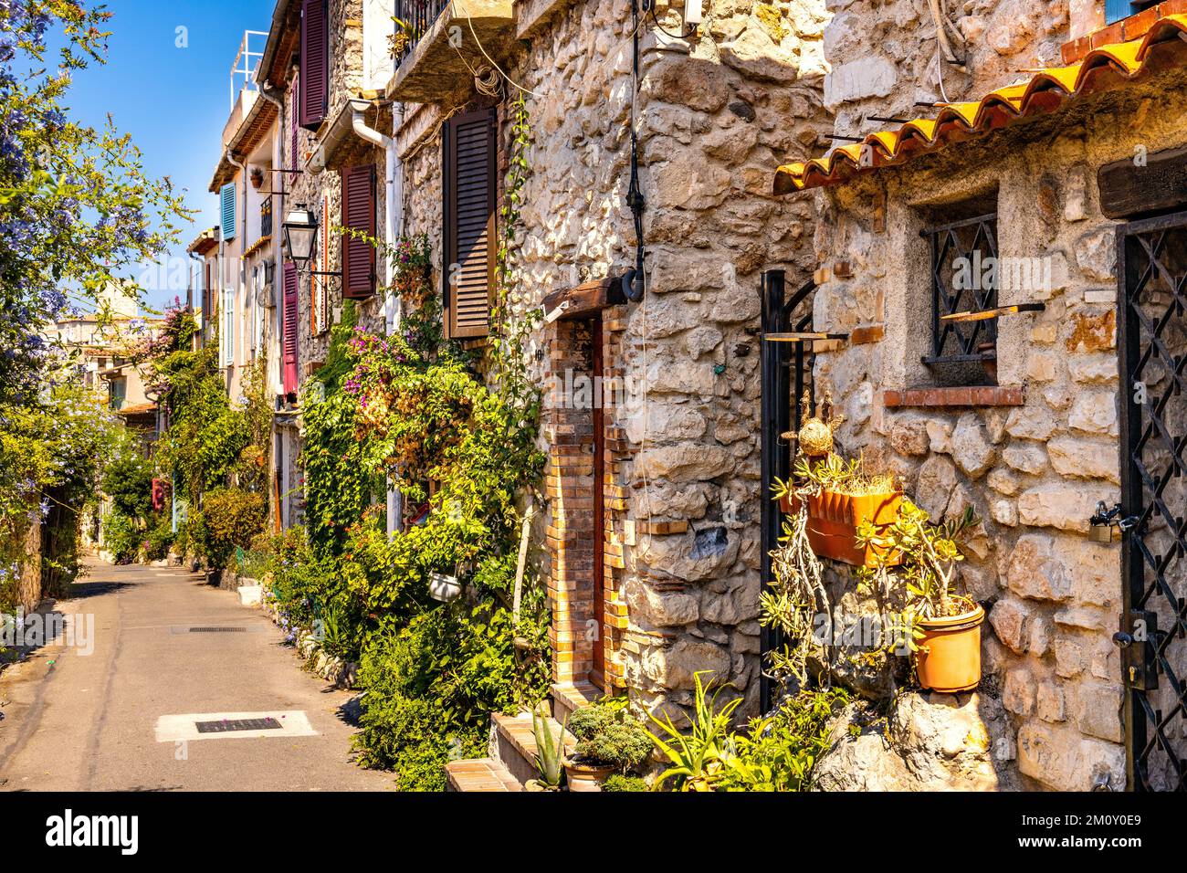 Antibes, France - August 4, 2022: Rue des Revennes street with colorful ...