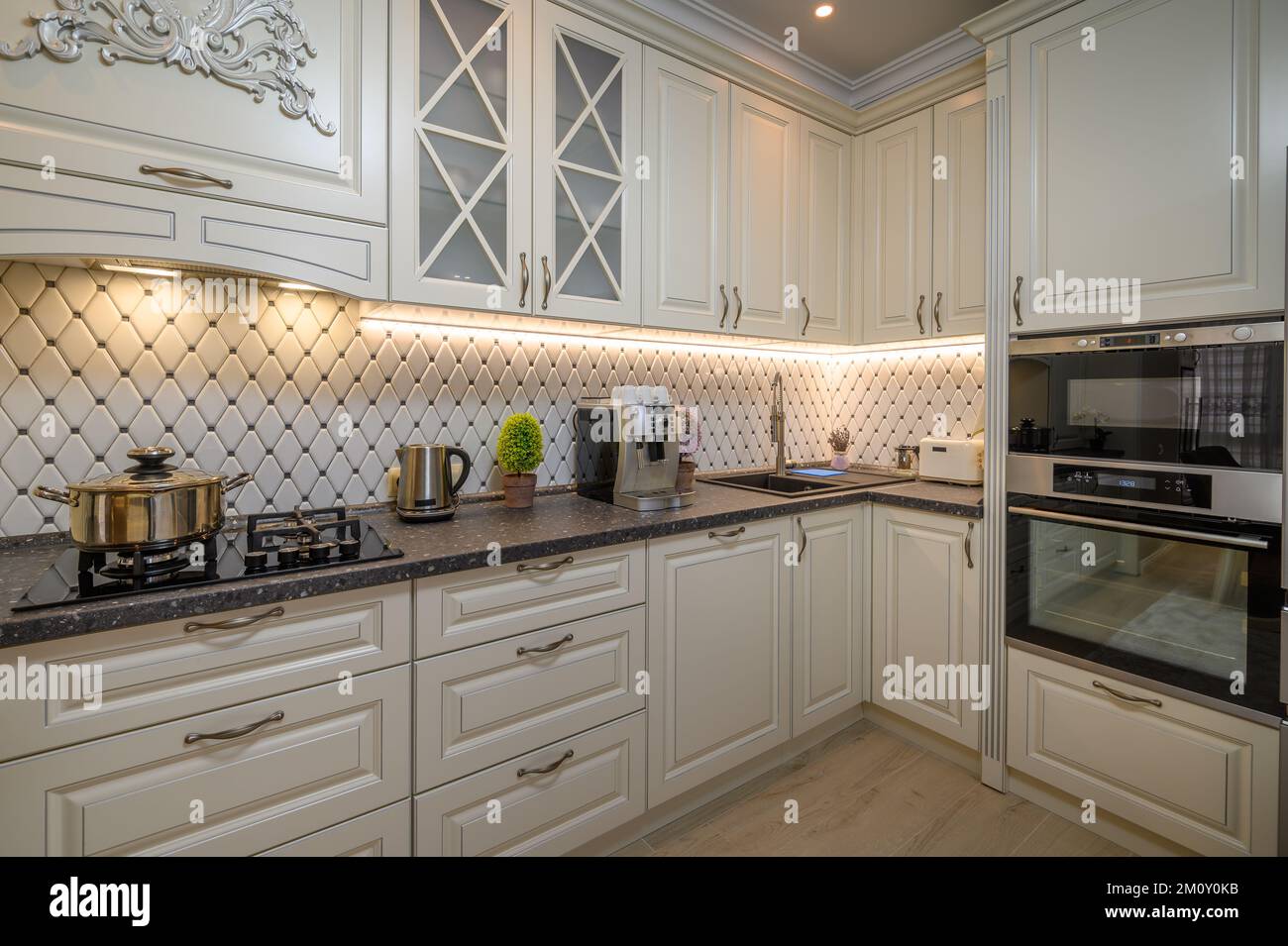 Classic beige kitchen with counter space and a variety of appliances ...