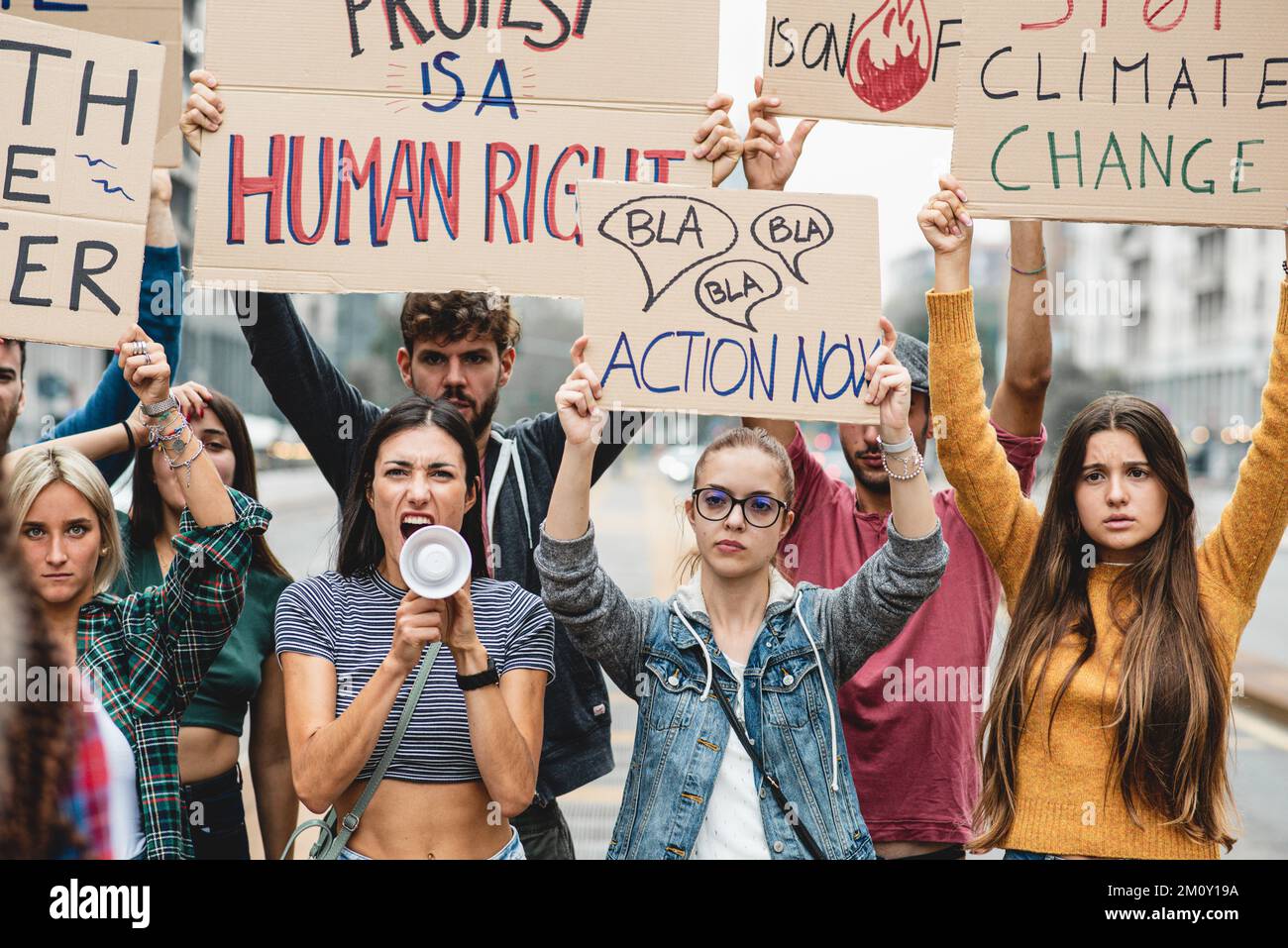 Group of multiethnic people making protest about climate change, public ...