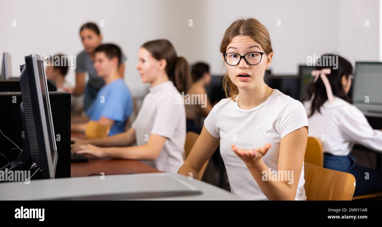 Portrait of smart girl in computer class Stock Photo - Alamy
