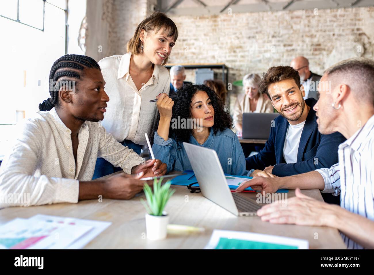 Young creative designer people working together and planning strategy ...