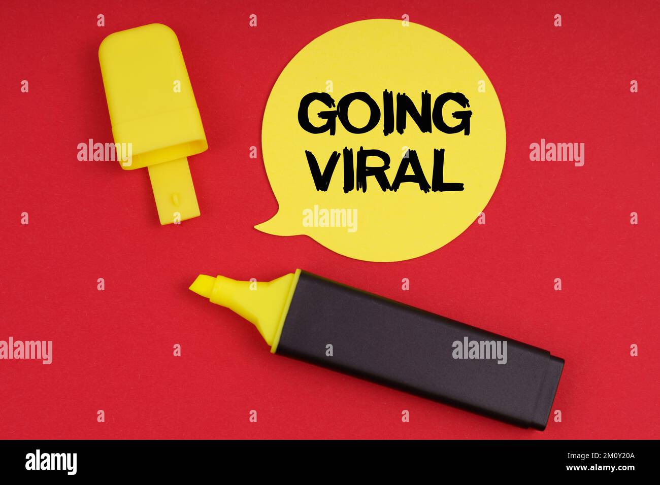 Business concept. On a red background is a marker and a sticker with ...