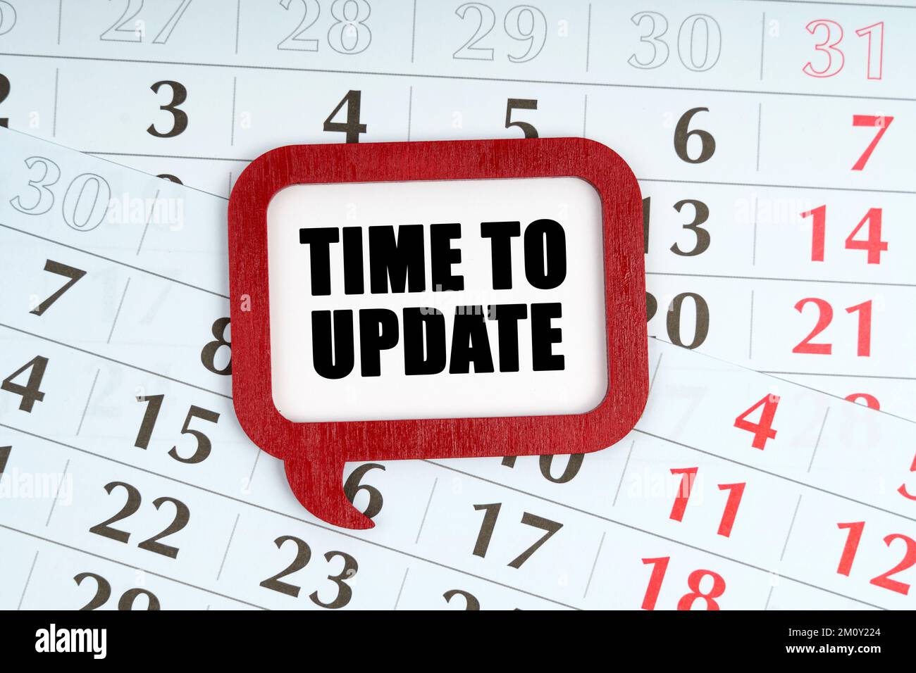 Business concept. On the calendar, a red plaque with the words inside ...