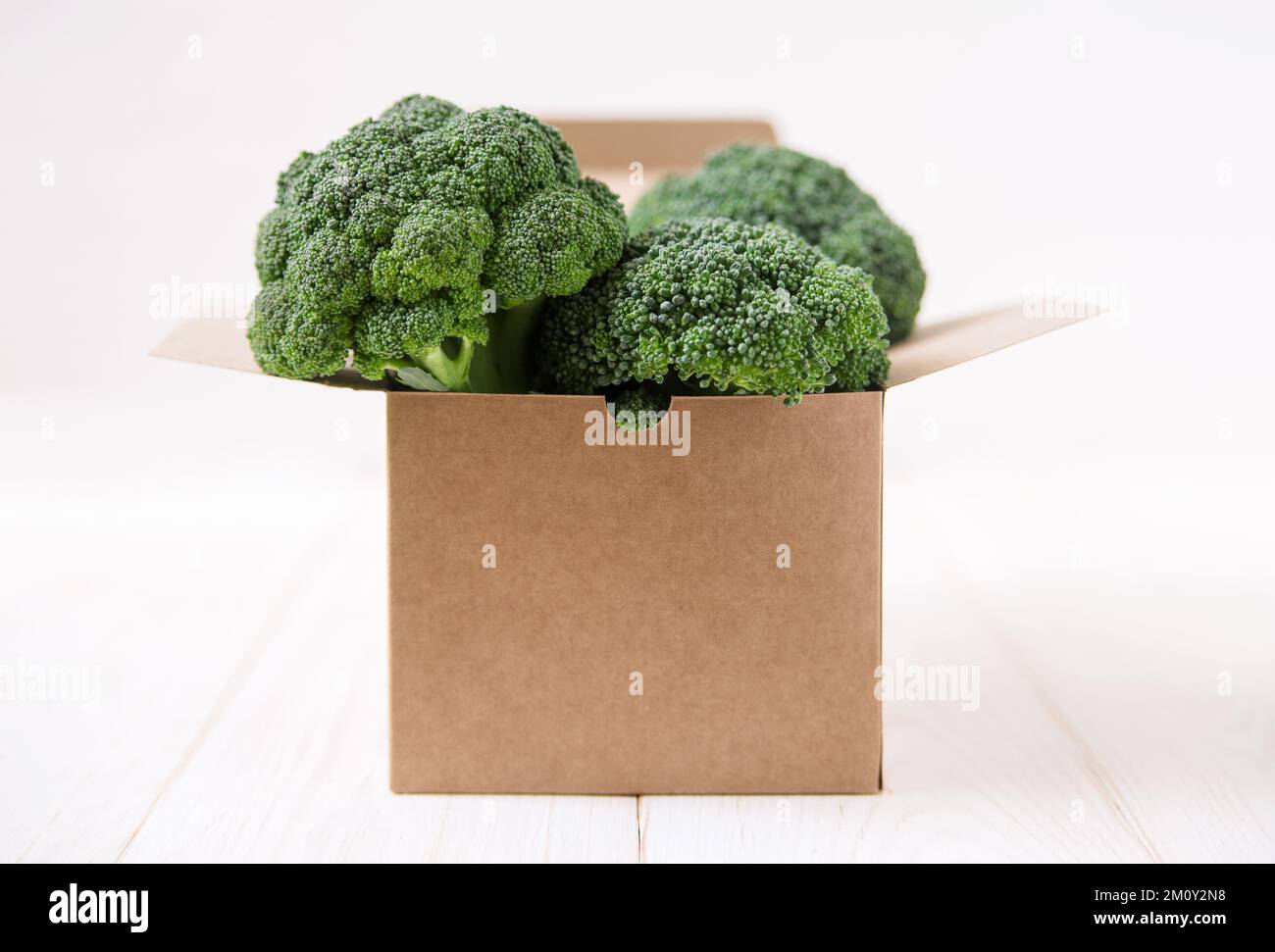fresh broccoli in a cardboard box.vegetables delivery concept Stock ...