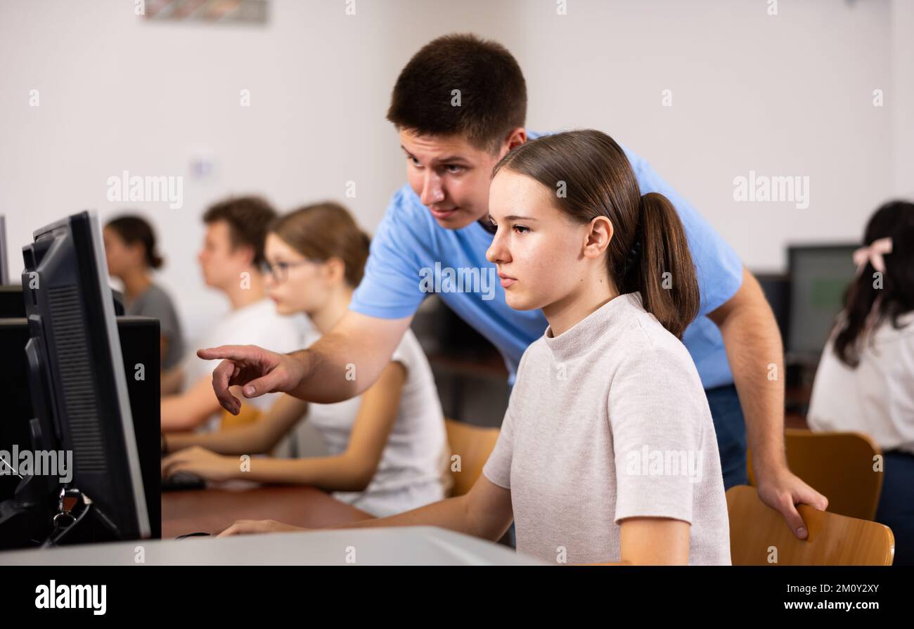 Young boy and girl using personal computer in school Stock Photo - Alamy