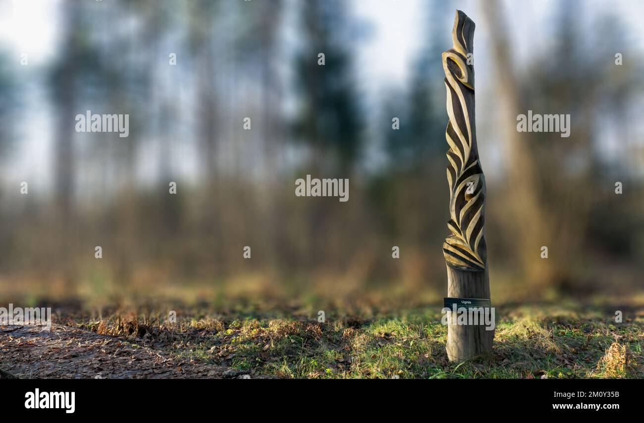 Baltic mythology and its gods. ''Ugnis'' Fire. Wooden sculpture Stock ...