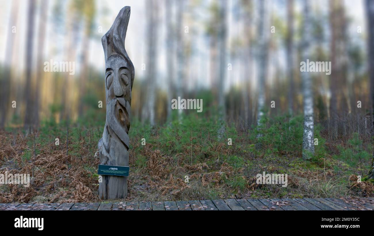 Wooden sculpture, pagan mythology. ''Upinis'' Stock Photo - Alamy