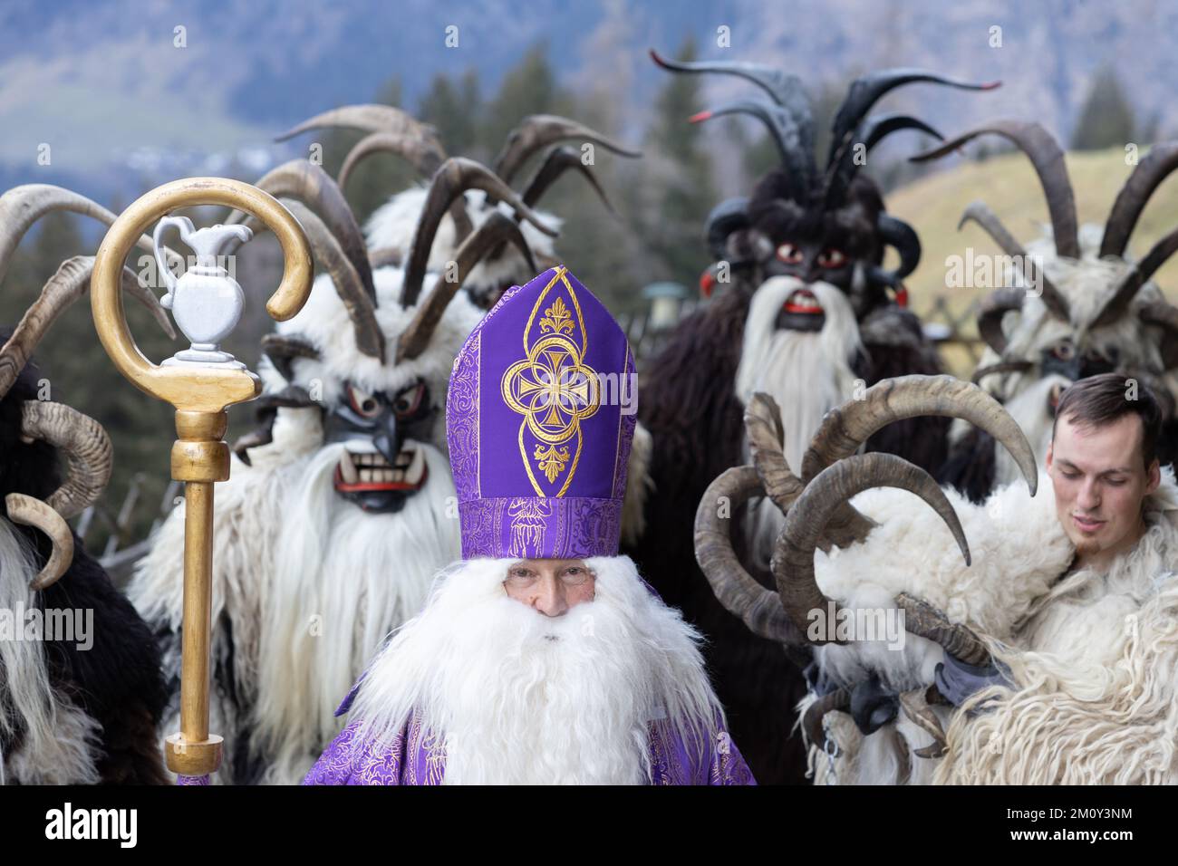 Saint Nicholas and four Krampus prepare for the Christmas procession ...