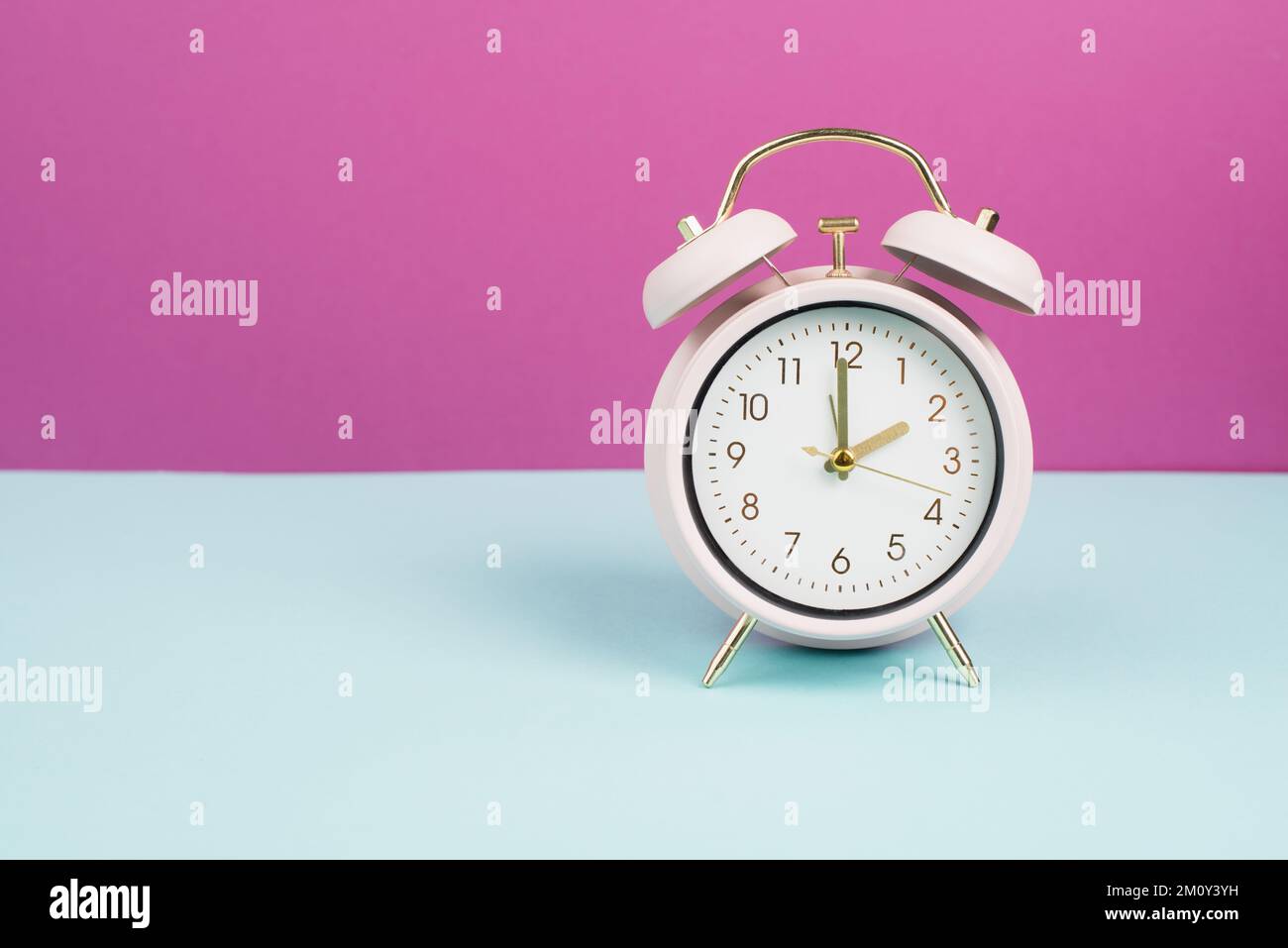 Alarm clock in old retro style, pastel color, time to wake up in the ...