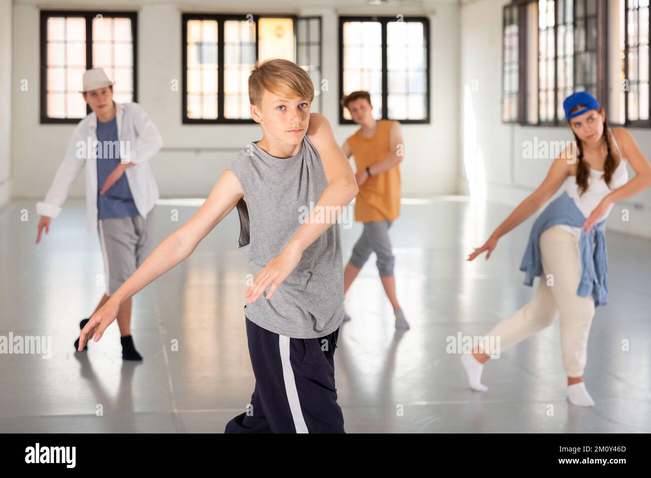 Teenage boy practicing active dance at studio Stock Photo - Alamy