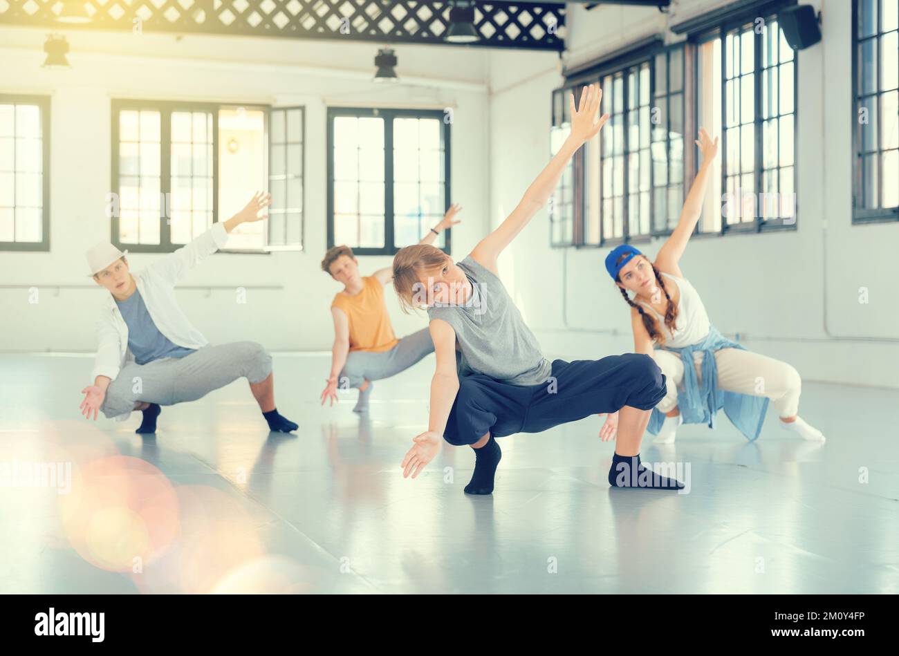 Team of young dancers training moves Stock Photo - Alamy