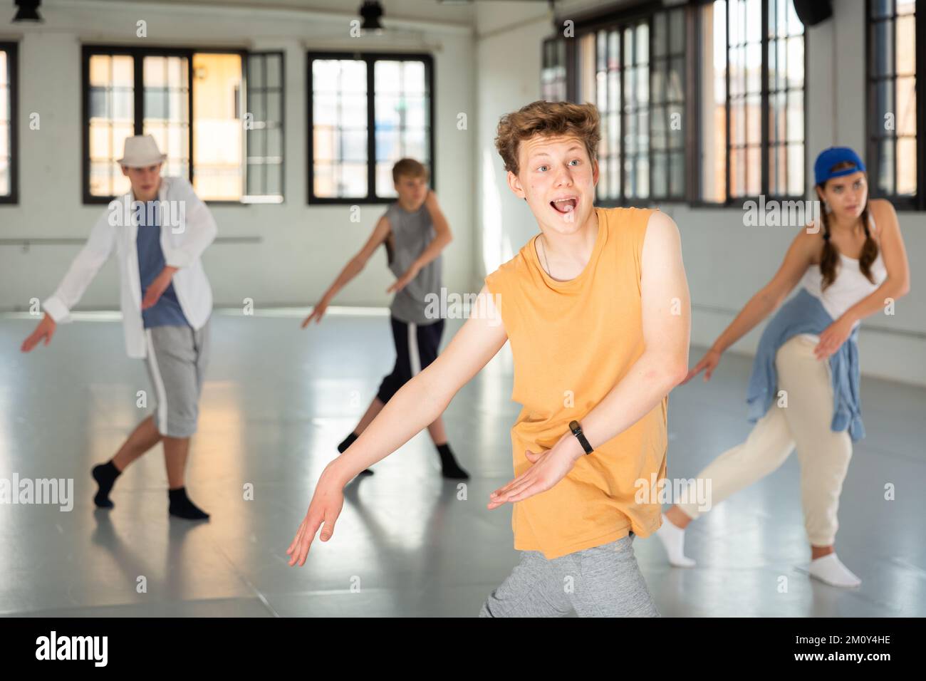 Teenage boy practicing active dance at studio Stock Photo - Alamy