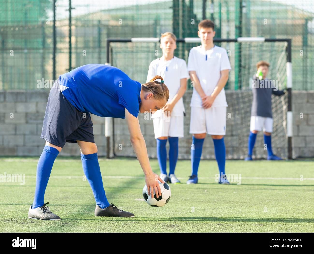 Two youth teams play football Stock Photo - Alamy
