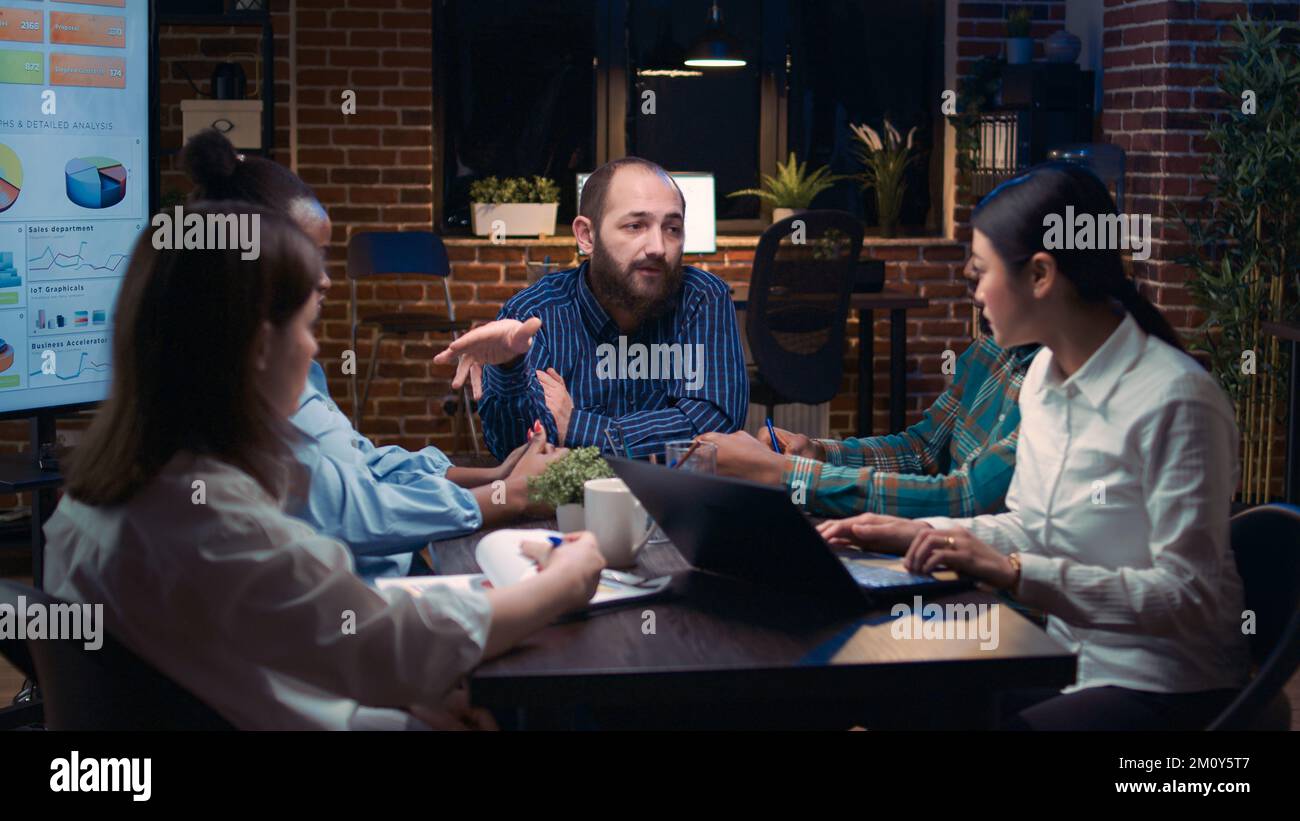 Diverse coworkers brainstorming, planning strategy in business meeting ...