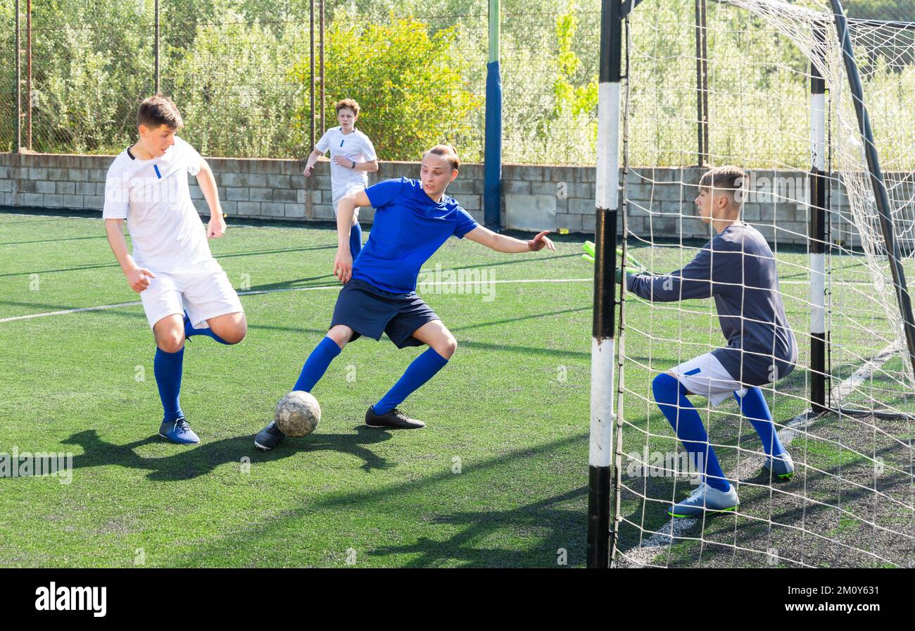 Defender tackles the ball in the penalty area Stock Photo - Alamy