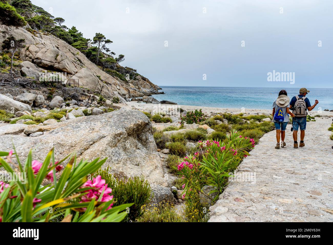 Two hikers in the isle of Montecristo, part of the Tuscan Archipelago ...