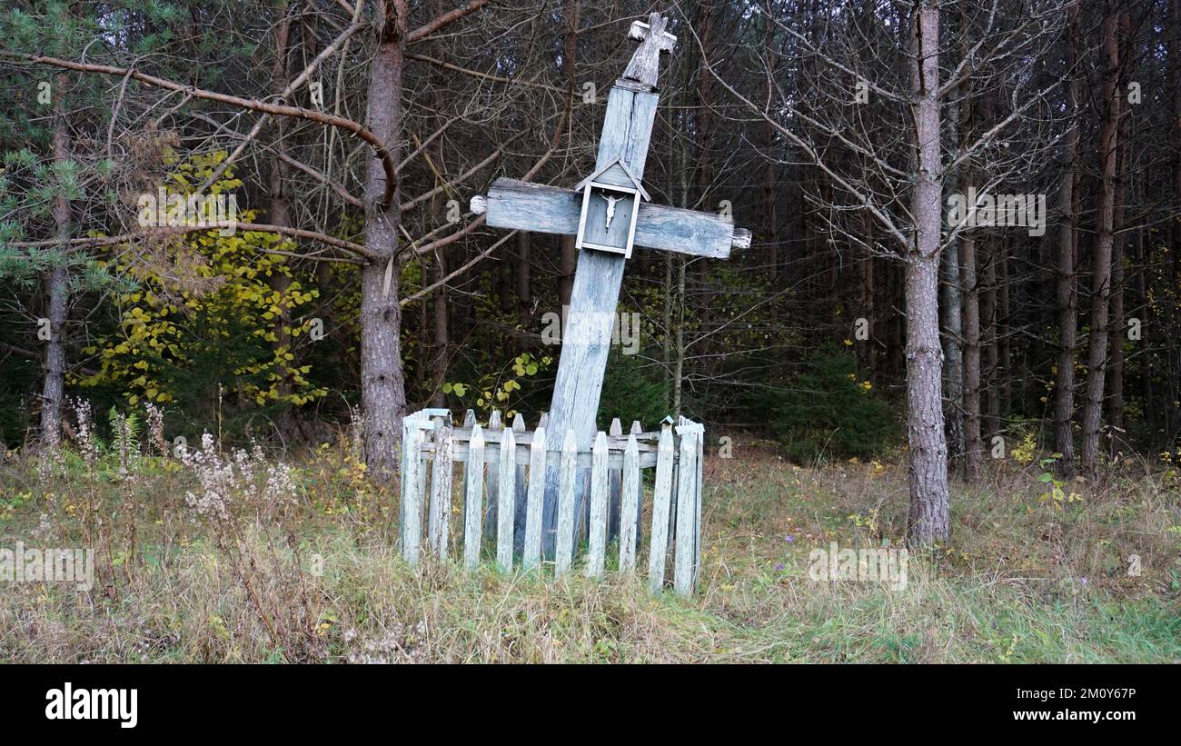 Cross. Roadside symbol, an arrow of faith. Ancient. A wooden cross on ...
