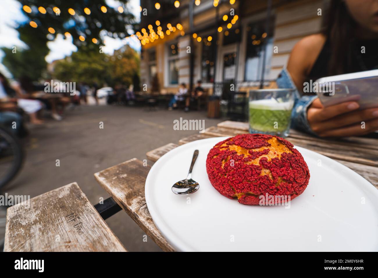 Delicious Cake shu eclairs with red strawberry crumble on table Stock ...