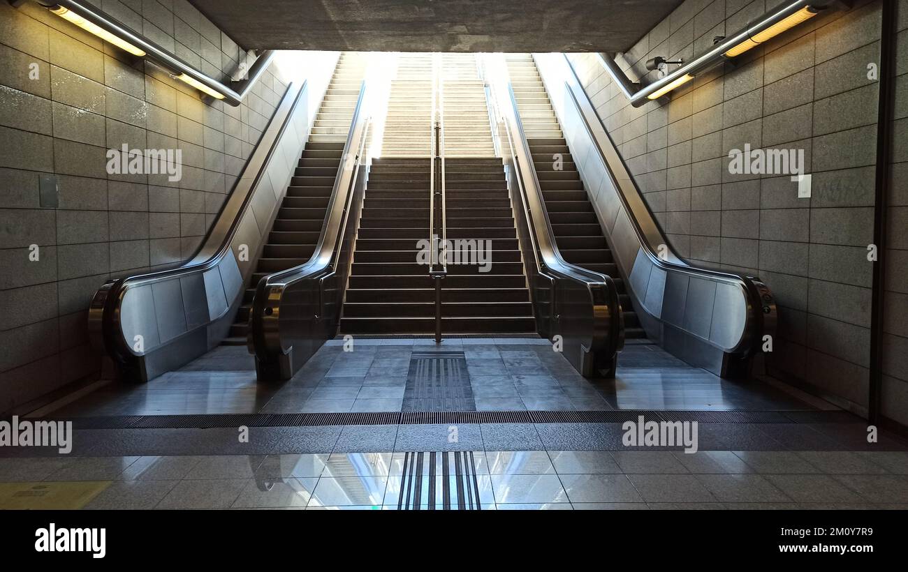 The stairs of a metro station in Athens, Greece, with a beam of light ...