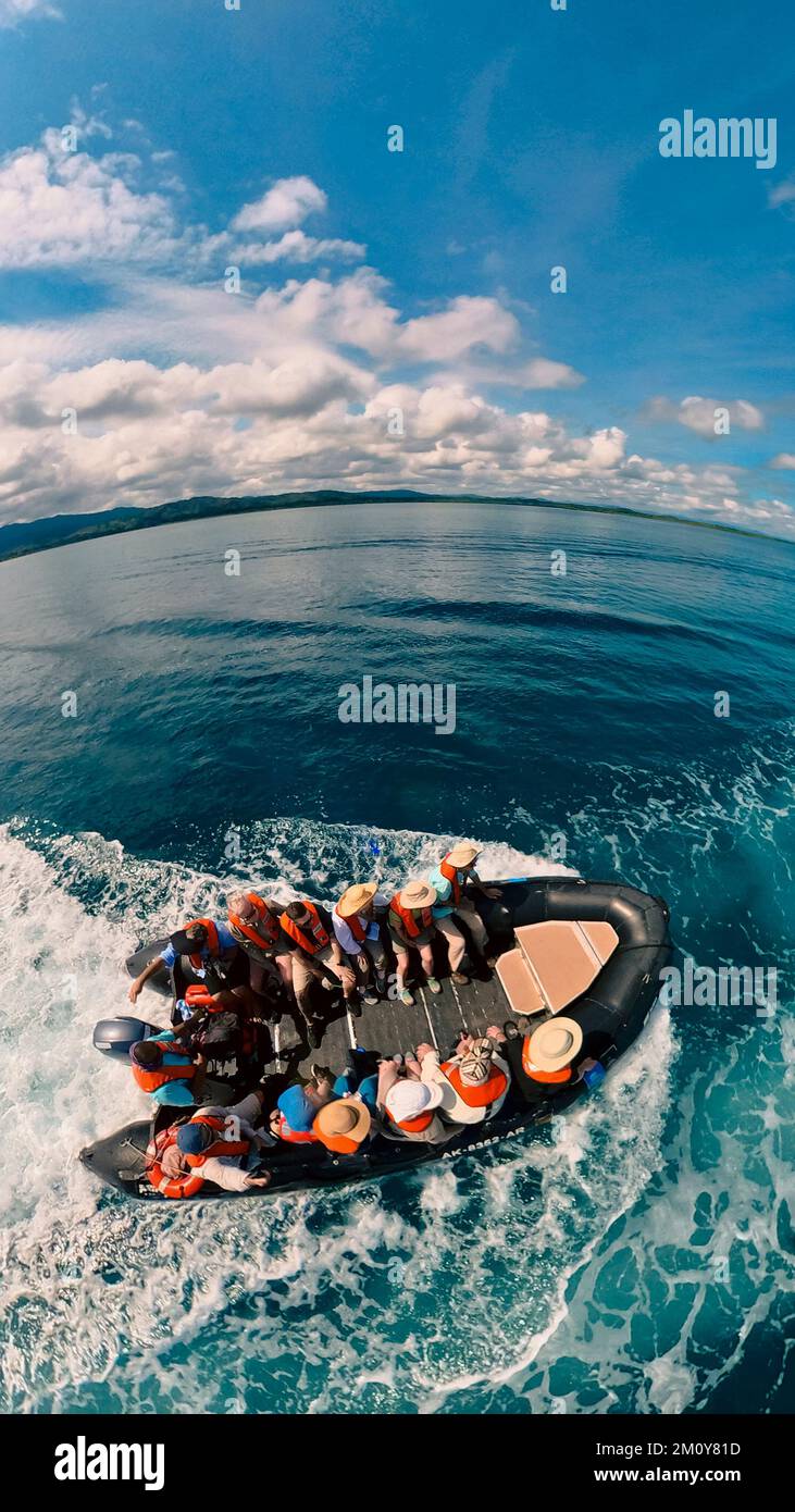 Travelers exploring the turquoise water of the Guna Yala indigenous ...