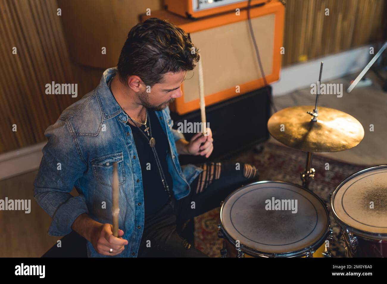 Young man playing drum hi-res stock photography and images - Alamy