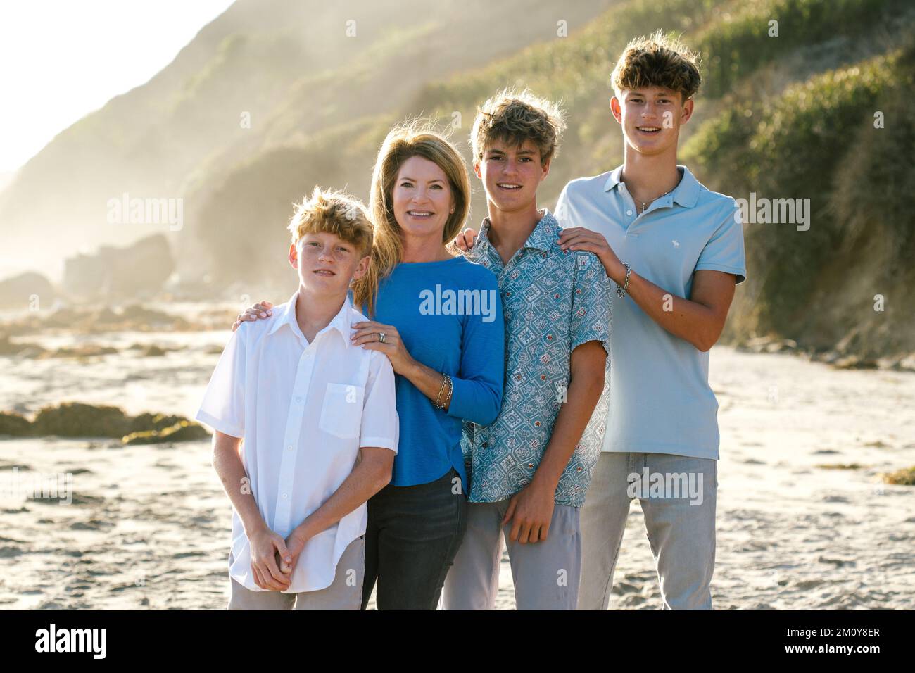 Portrait Of Mother And Three Teen Sons At The Beach Stock Photo - Alamy