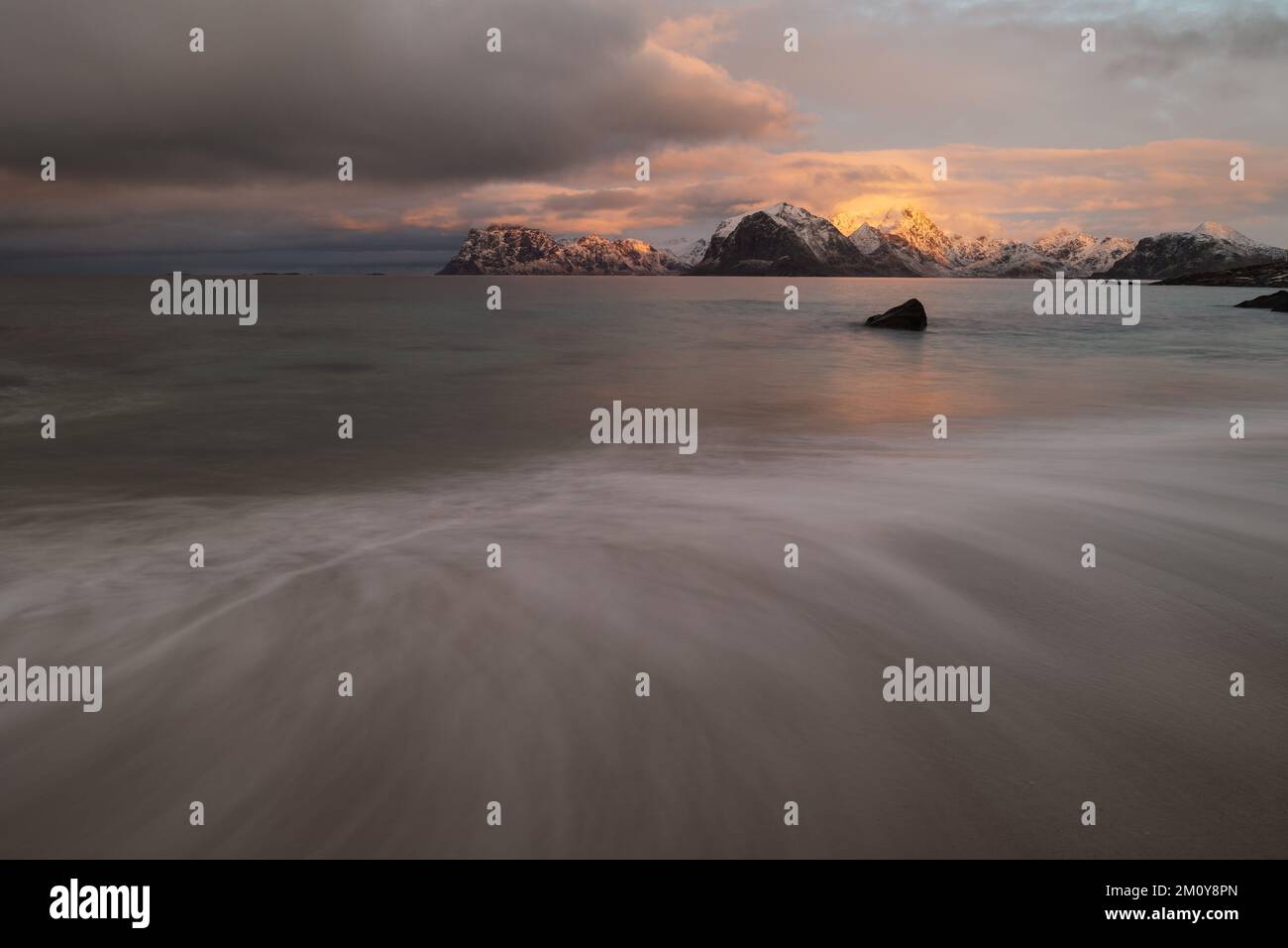 Tide flows over Myrland beach, Flakstadøy, Lofoten Islands, Norway ...