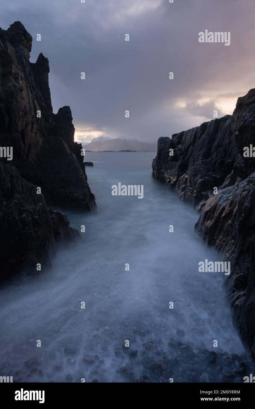 Waves flow through small rocky inlet, Lofoten Islands, Norway Stock ...