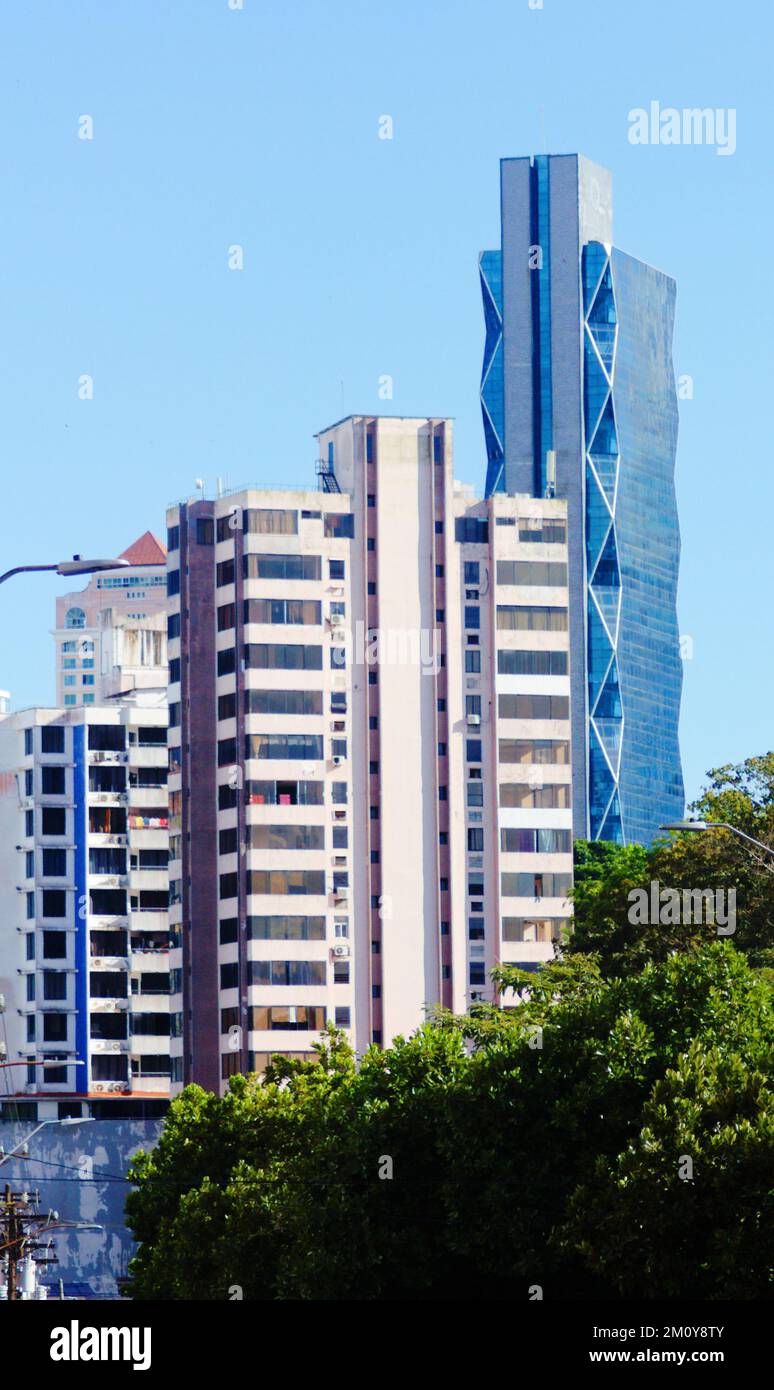 white building and behind a blue skyscraper Stock Photo - Alamy