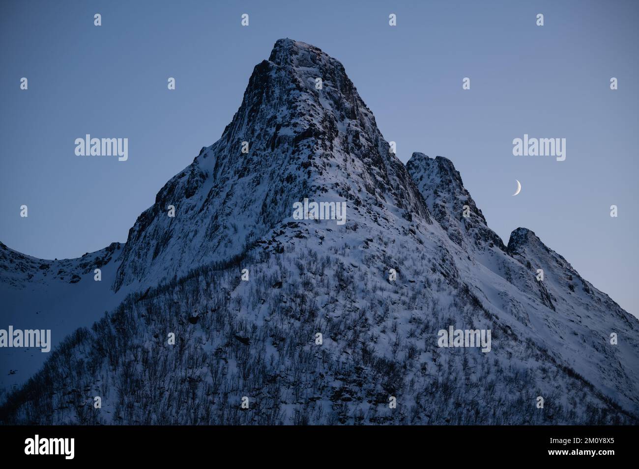 Crescent moon next to Mykjetind, Mefjordvær, Senja, Norway Stock Photo ...
