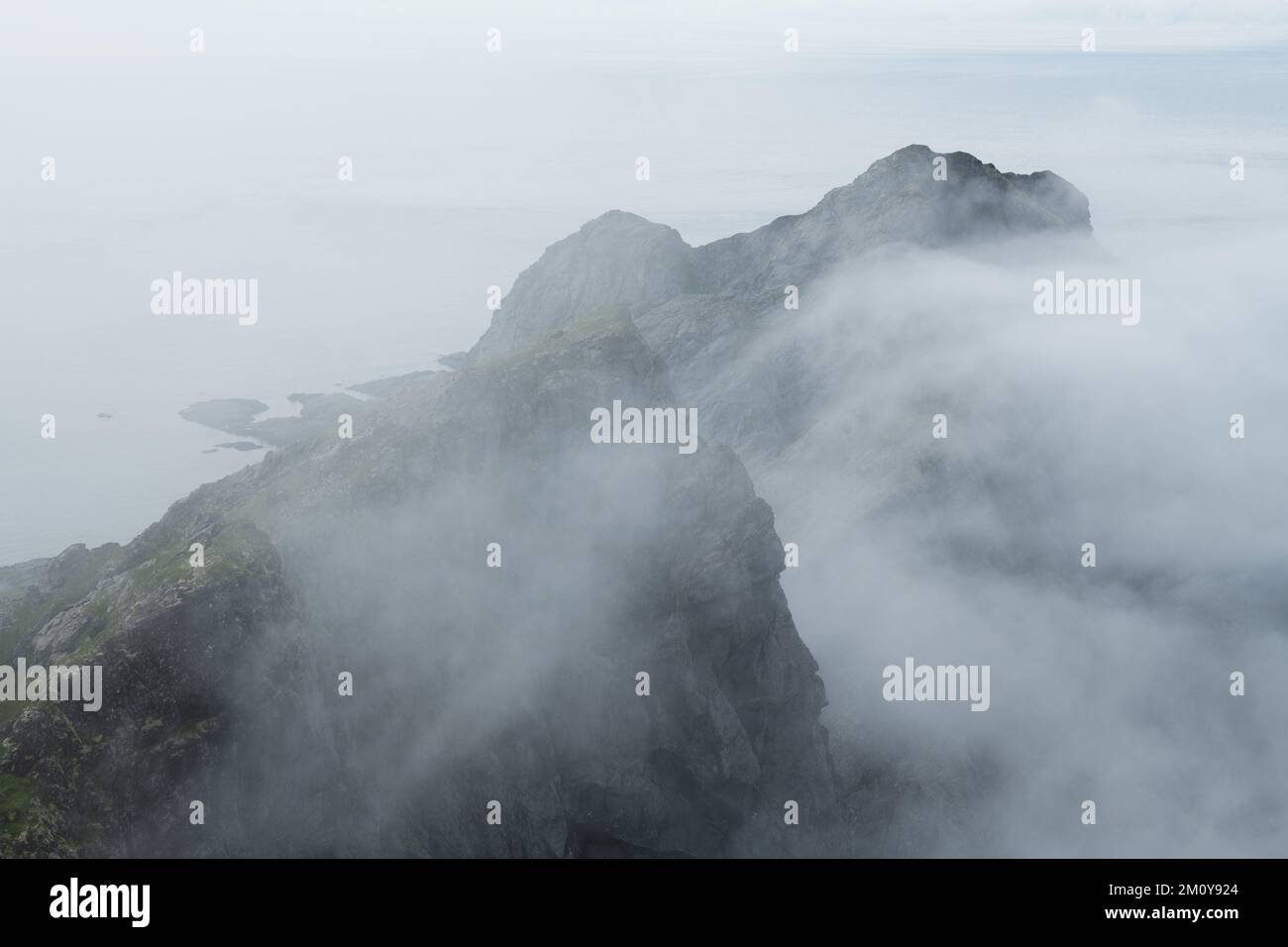 Misty mountains over Buvågen bay, Lofoten Islands, Norway Stock Photo ...