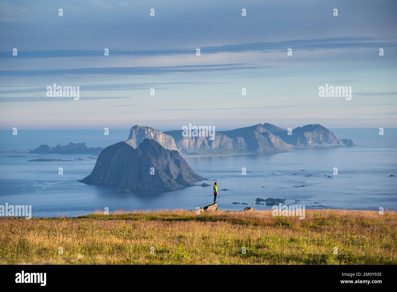 Female hiker on Hellsegga plateau overlooking Moskstraumen towards ...