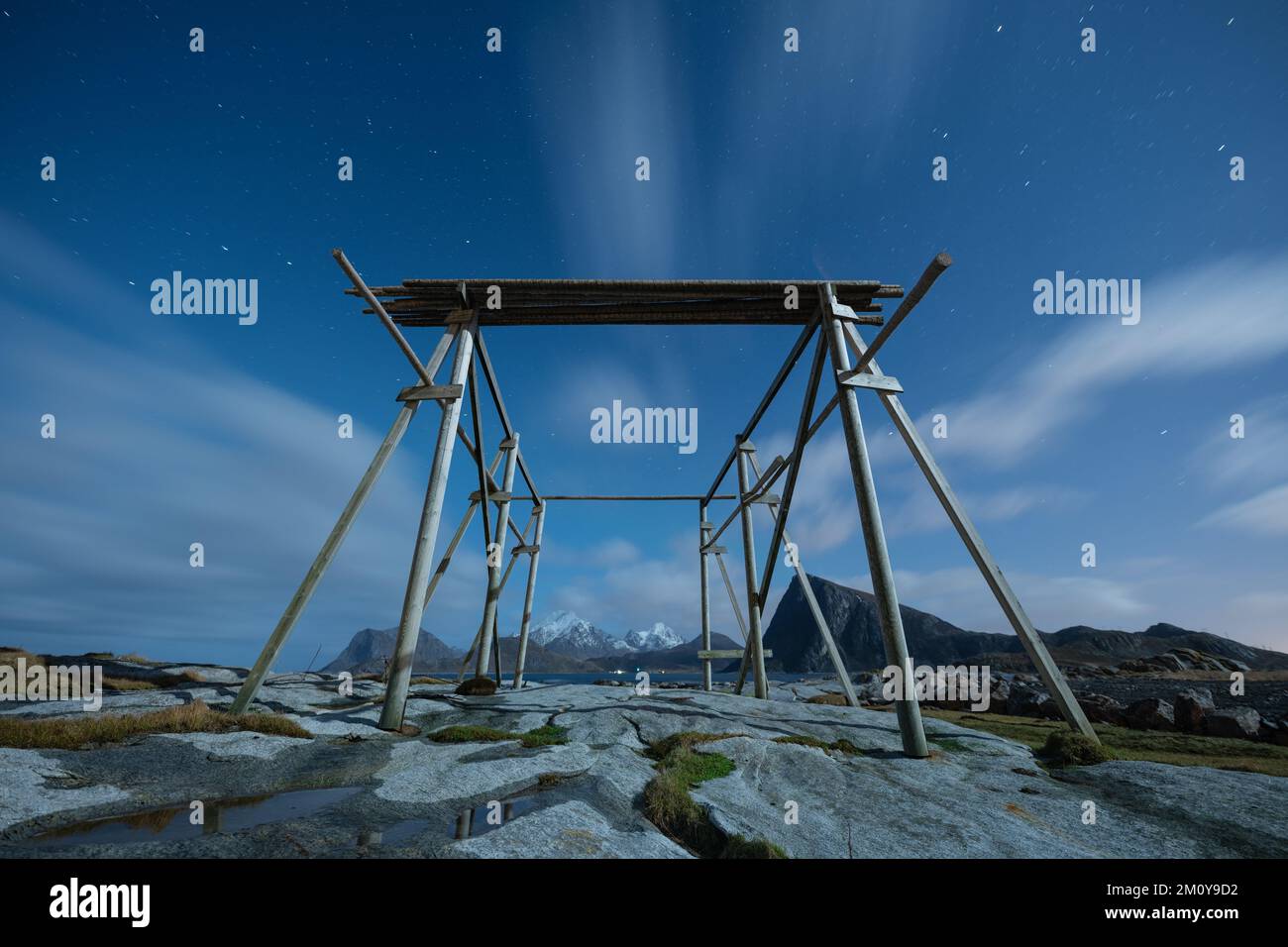 Empty cod fish drying rack lit by full moon, Lofoten Islands, Norway ...