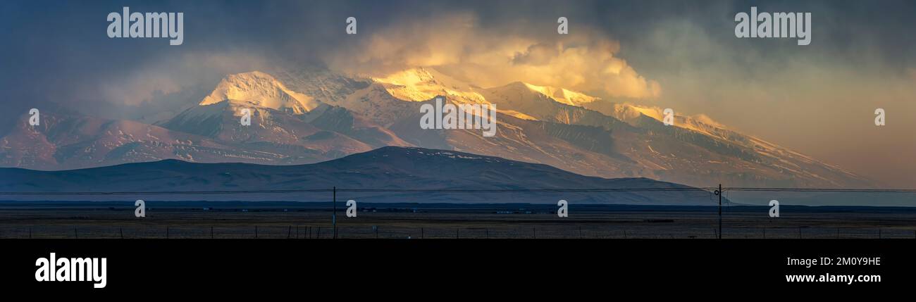 A panoramic view of the sunset with Gurla Mandhata peak in Himalayas ...