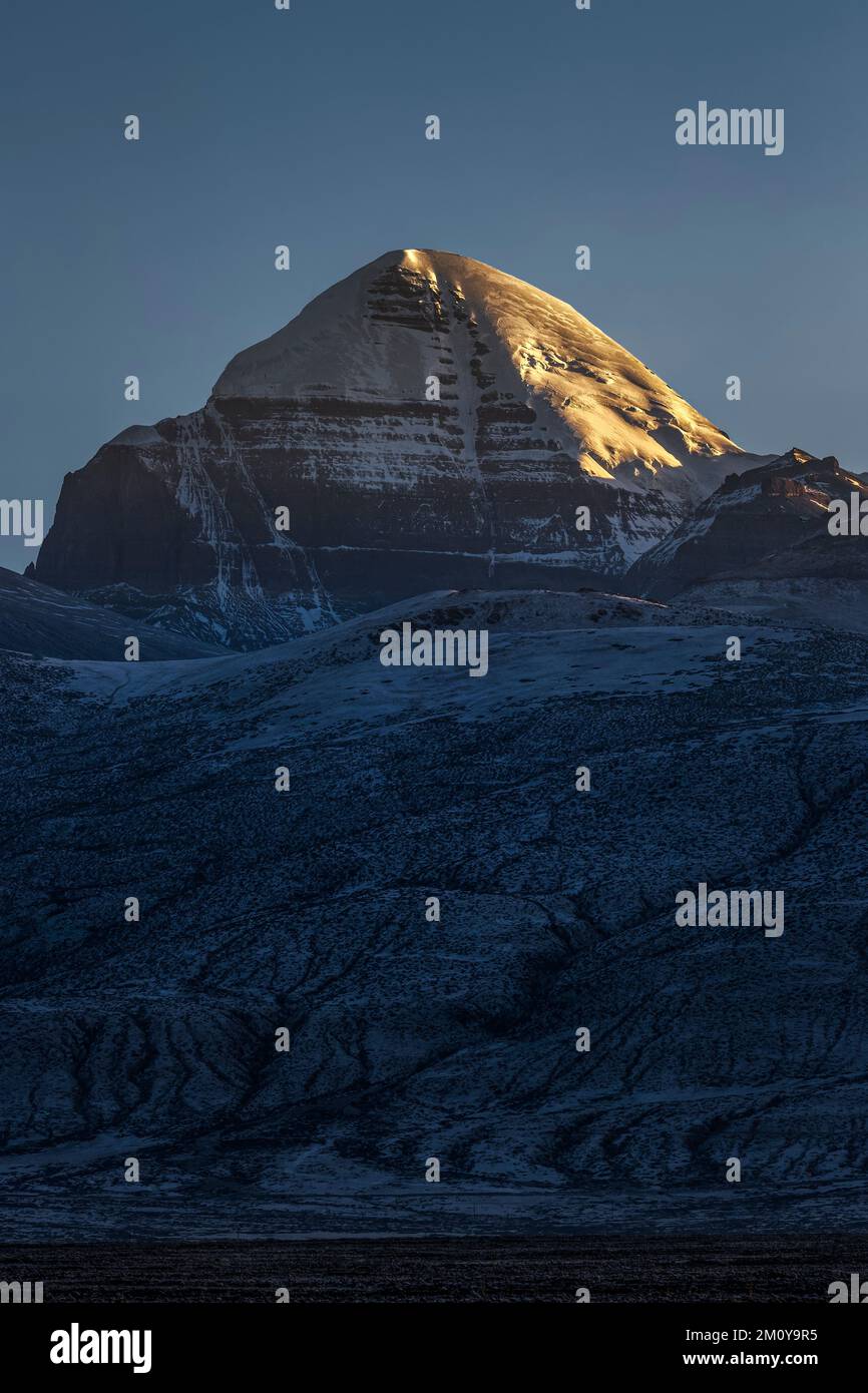 A vertical shot of sunrise with Mount Kailash in Taqin County, Ali ...